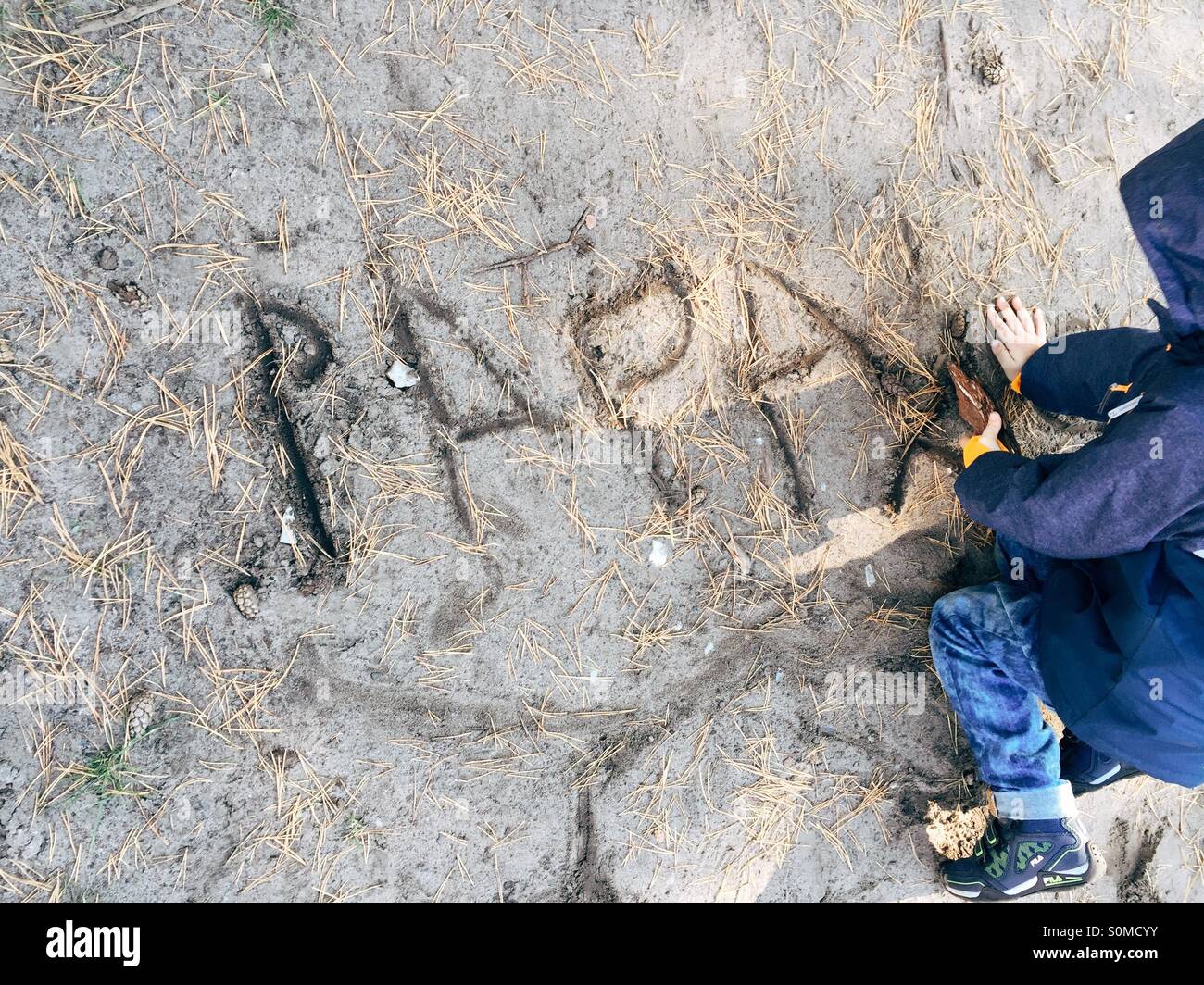 Child writing sand hi-res stock photography and images - Alamy