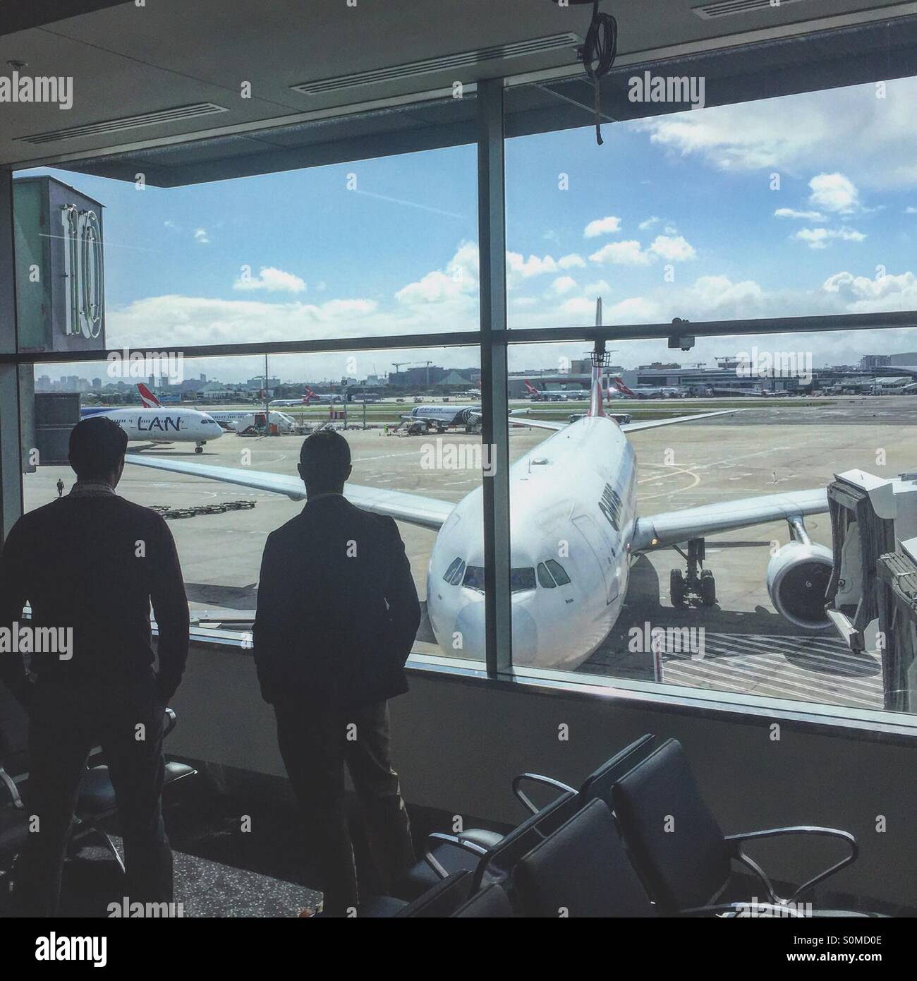 Waiting at the gate Stock Photo - Alamy