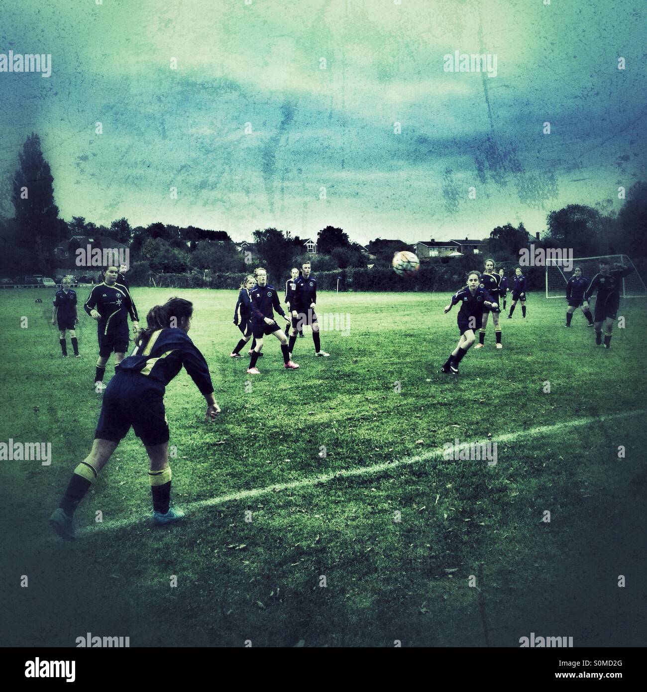Throw in girls football match Stock Photo - Alamy