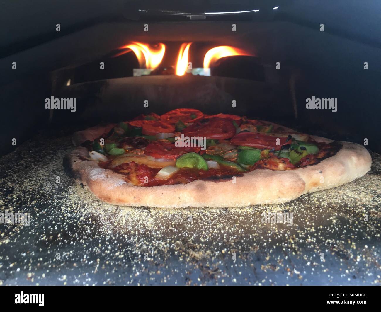 Fire pizza hi-res stock photography and images - Alamy