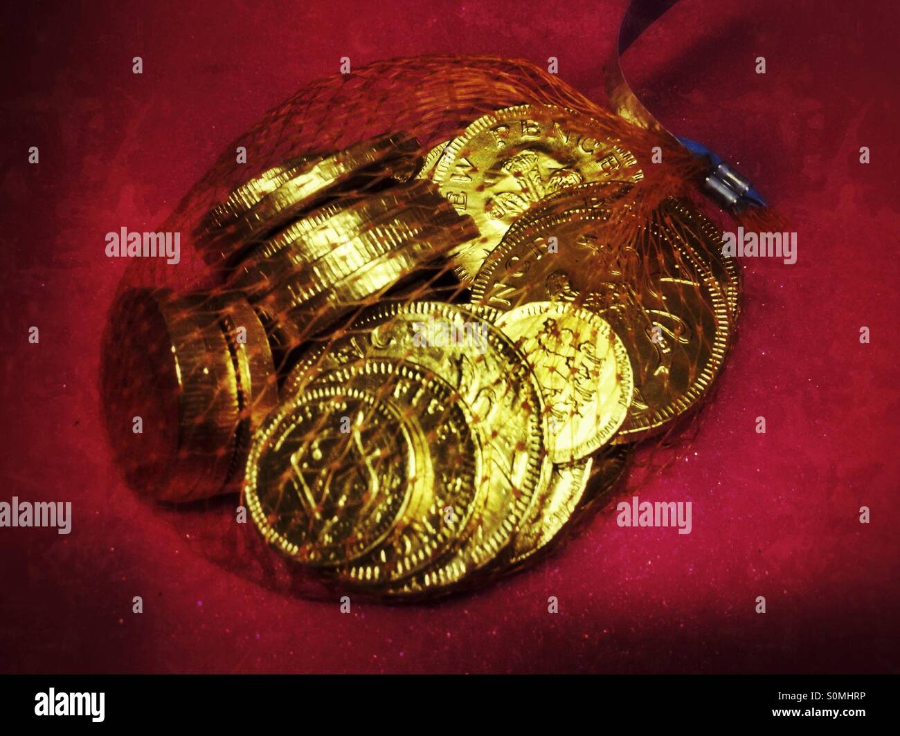 Bag of chocolate coins Stock Photo - Alamy