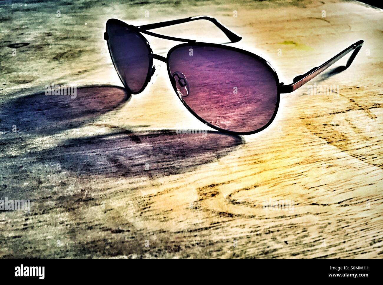 Sunglasses on a table Stock Photo - Alamy