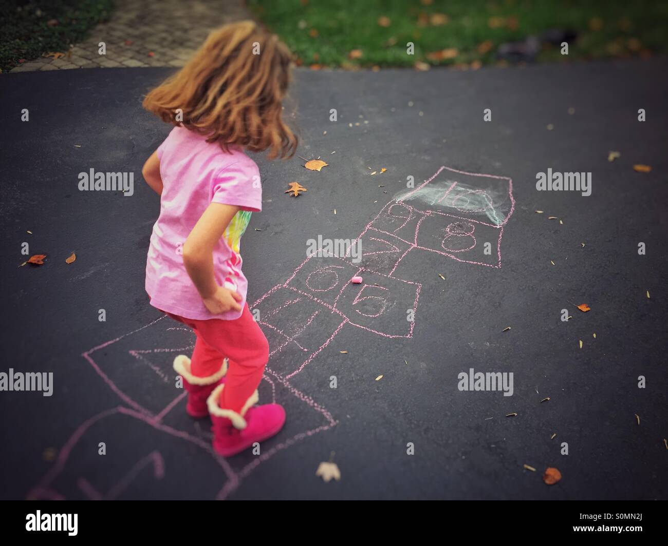 Girl Playing Hopscotch High Resolution Stock Photography and Images - Alamy