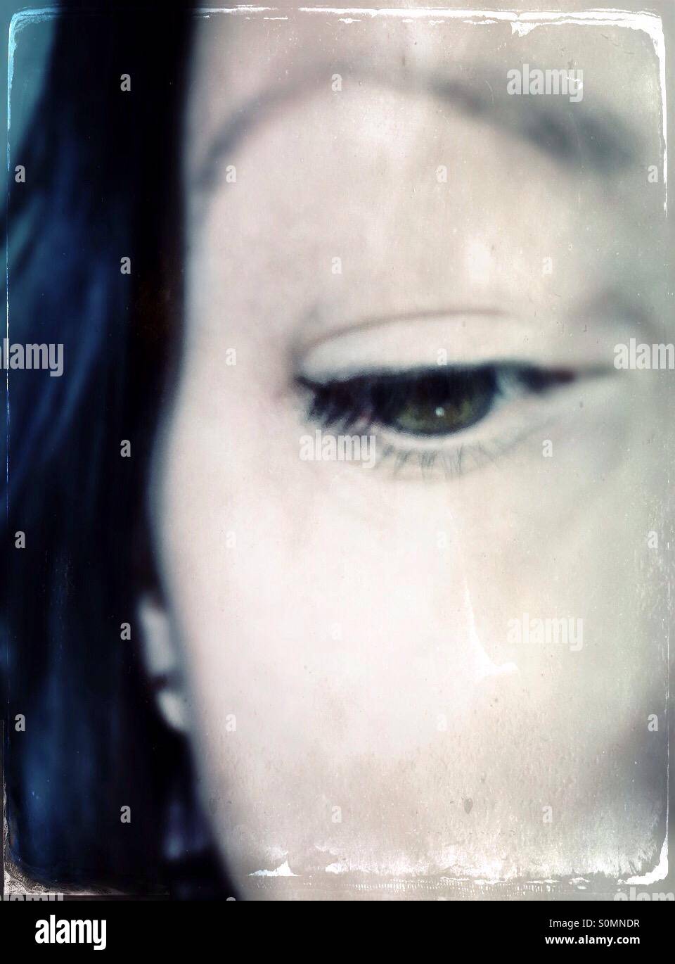 Female eye looking down Stock Photo - Alamy