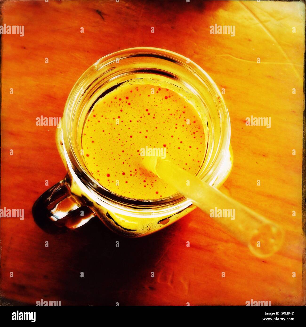 Juice smoothie in a jar mug with straw Stock Photo - Alamy