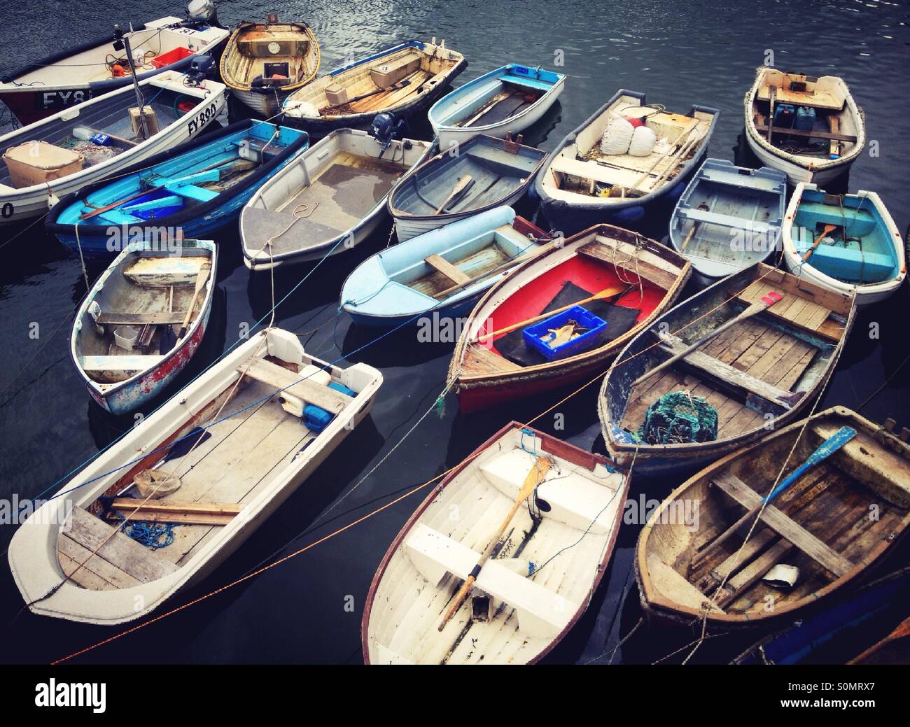 A collection of boats in a Cornish harbour Stock Photo - Alamy