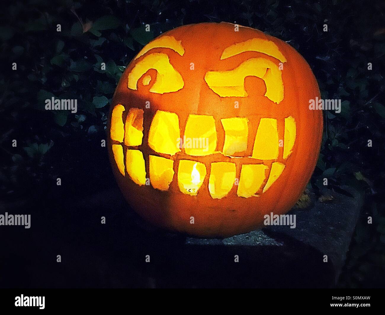 Halloween pumpkin smiling with big teeth and big eyes Stock Photo - Alamy