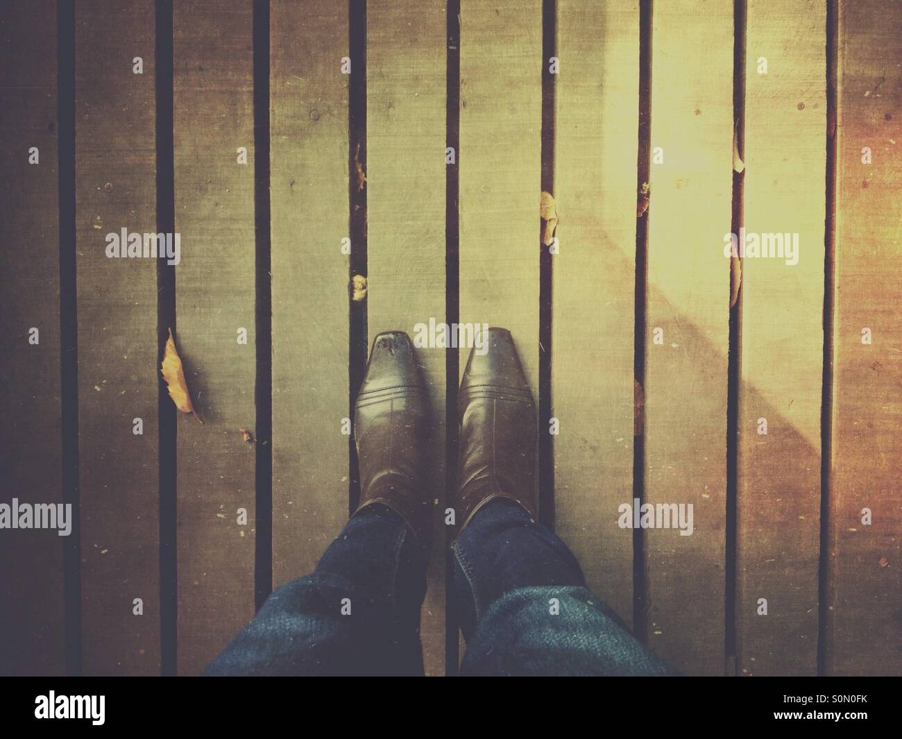 Feet on a wood bridge Stock Photo - Alamy