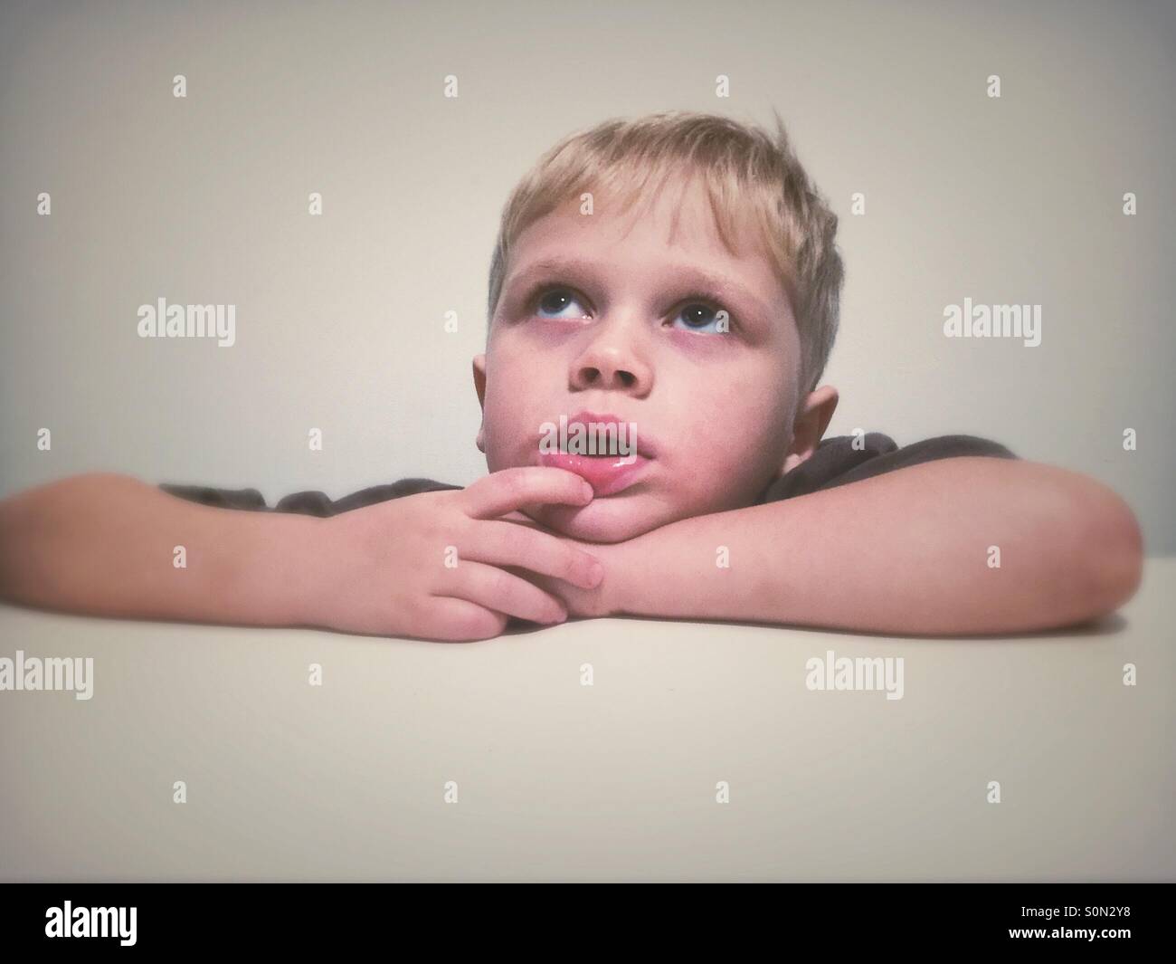 Child deep in thoughts hi-res stock photography and images - Alamy