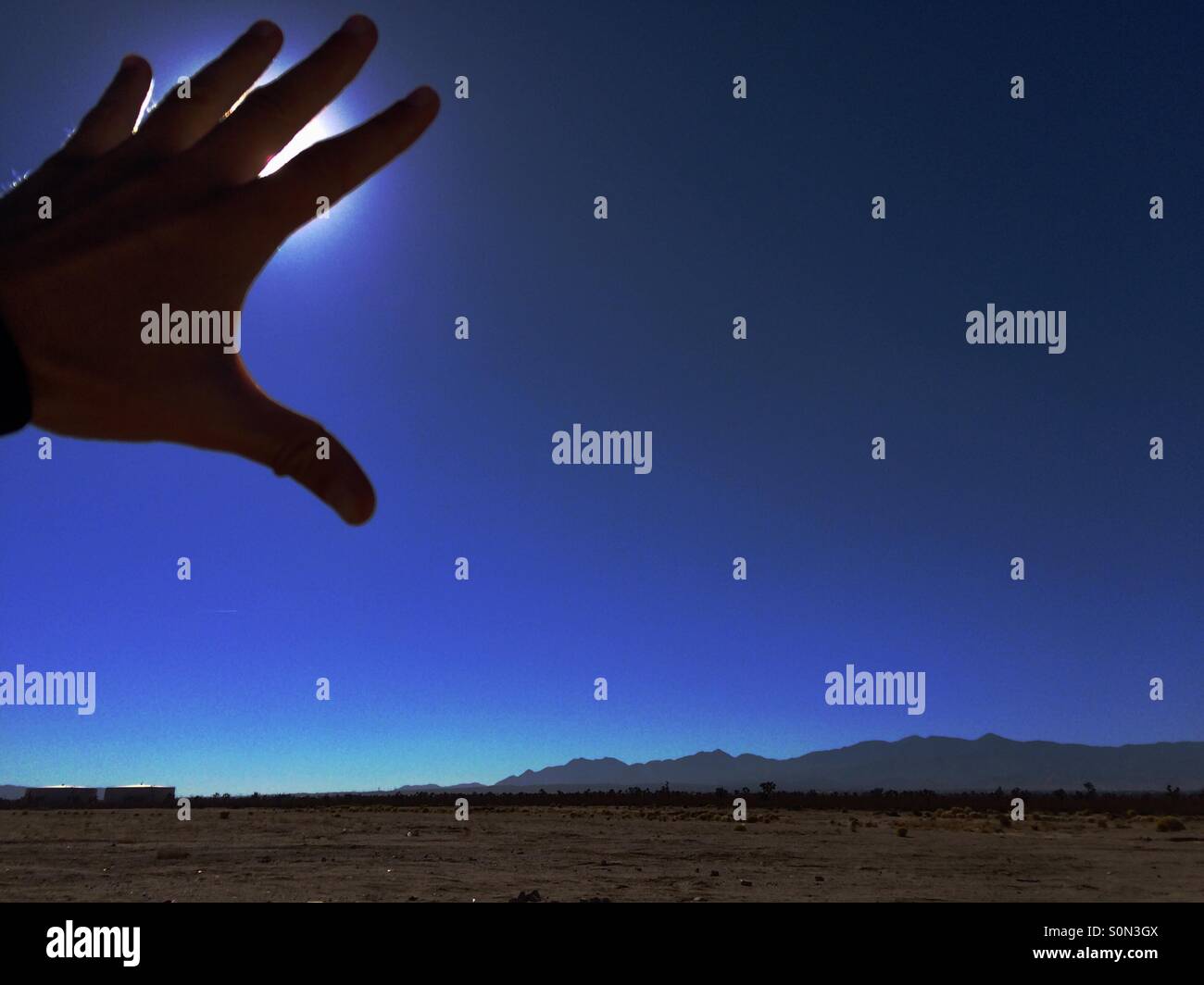 Total eclipse of the hand Stock Photo - Alamy
