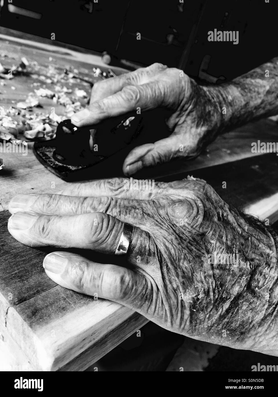 Old man working hard hi-res stock photography and images - Alamy