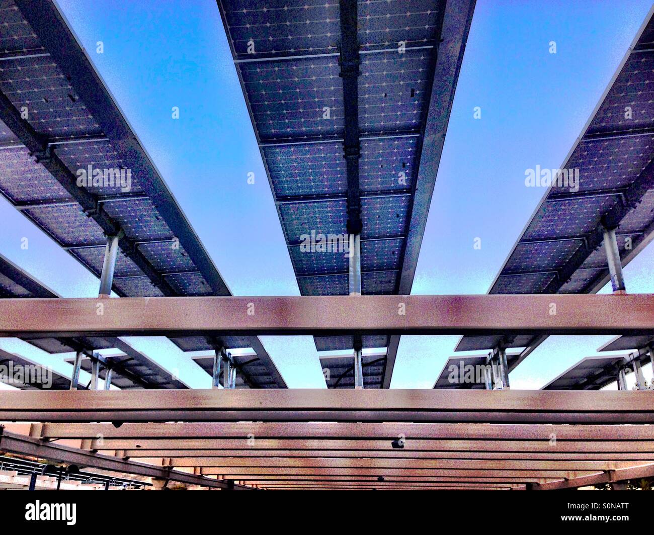 Solar panel array against a clear, blue sky Stock Photo - Alamy