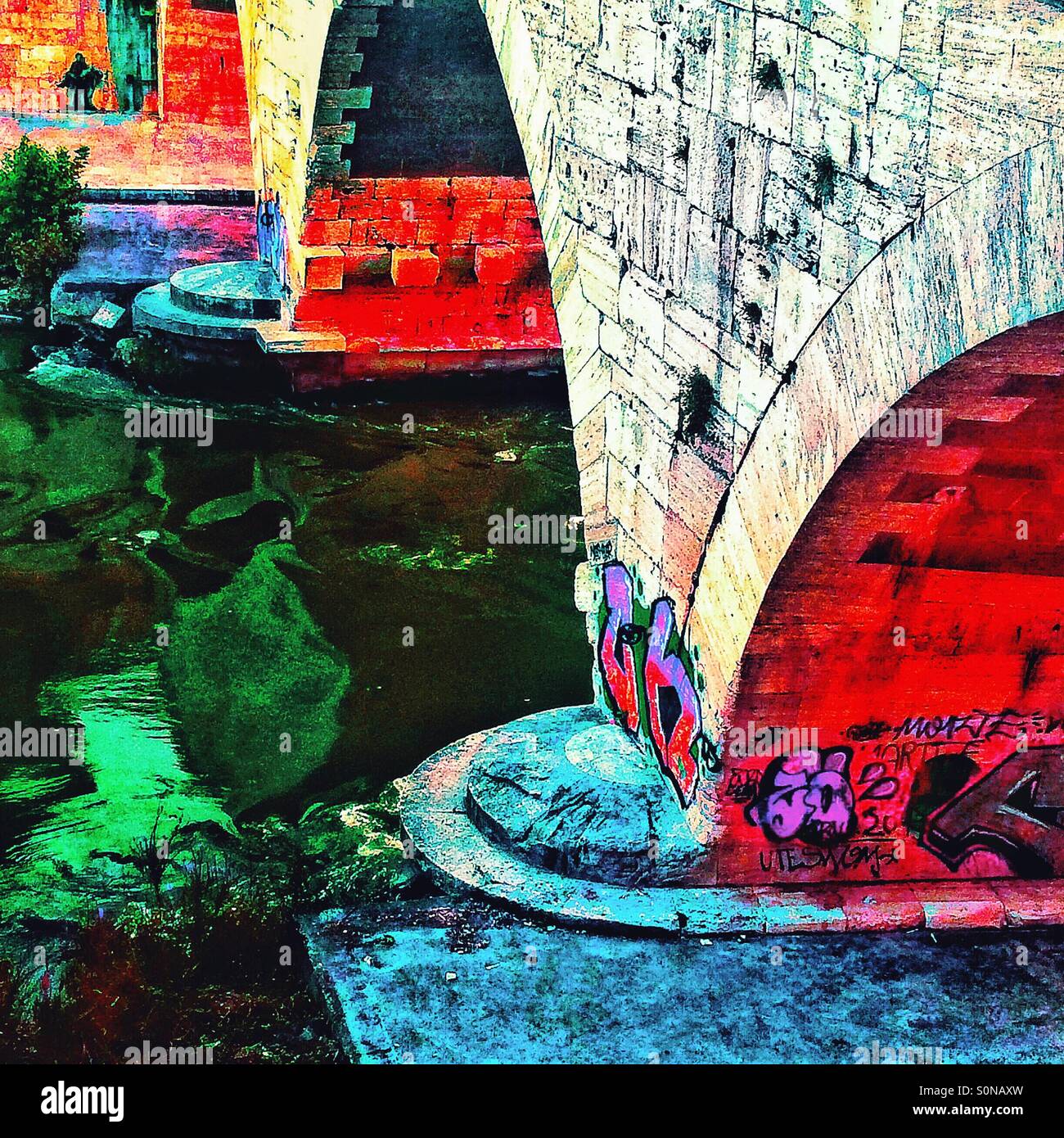 Riverside graffiti glow Stock Photo - Alamy