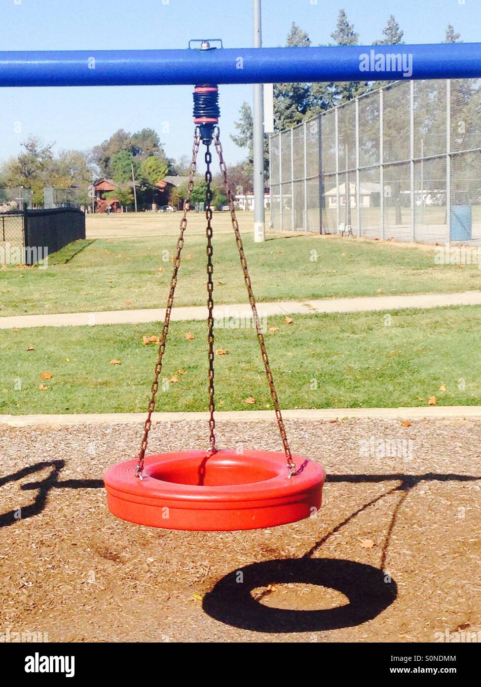 Red tire swing Stock Photo - Alamy