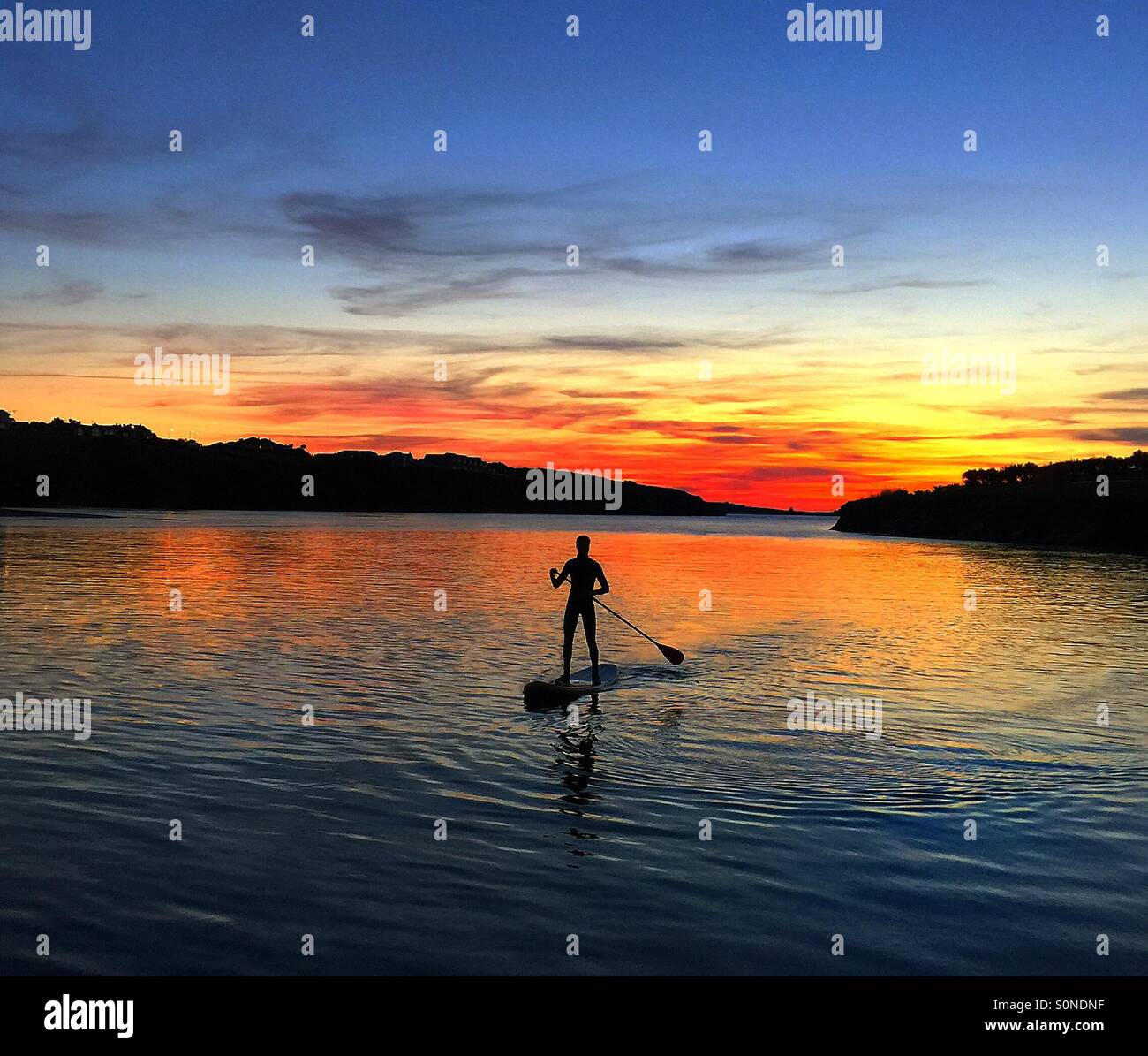 Paddle boarder in silhouette hi-res stock photography and images - Alamy