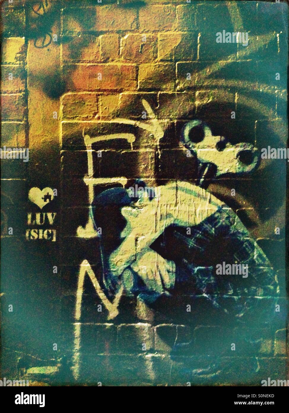 Street art of girl with wind up toy key on her back Stock Photo - Alamy