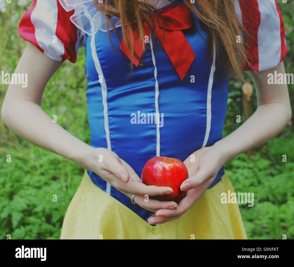 Snow White and an apple Stock Photo - Alamy