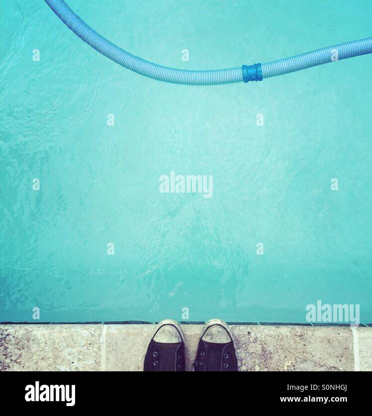 Feet at edge of pool Stock Photo - Alamy