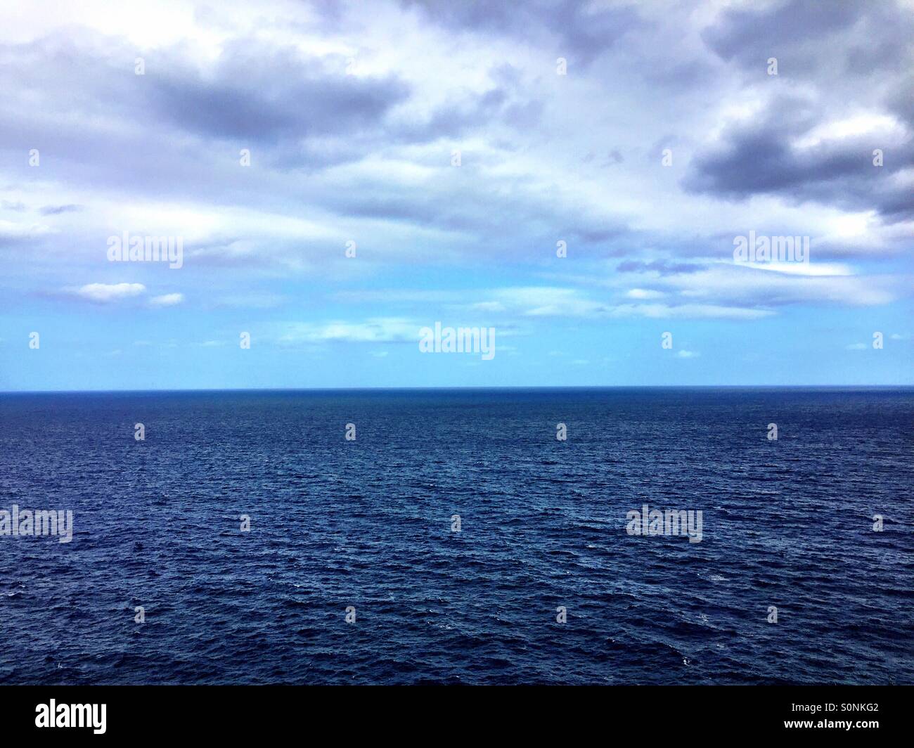 Blue sky and clouds at ocean hi-res stock photography and images - Alamy