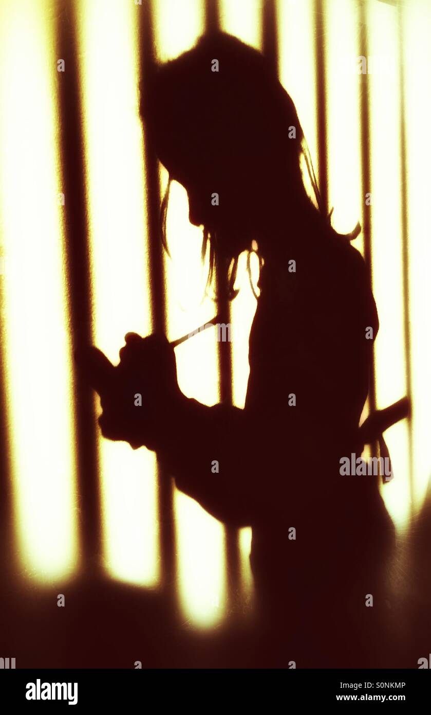 Shadow of young girl playing at being a waitress Stock Photo - Alamy