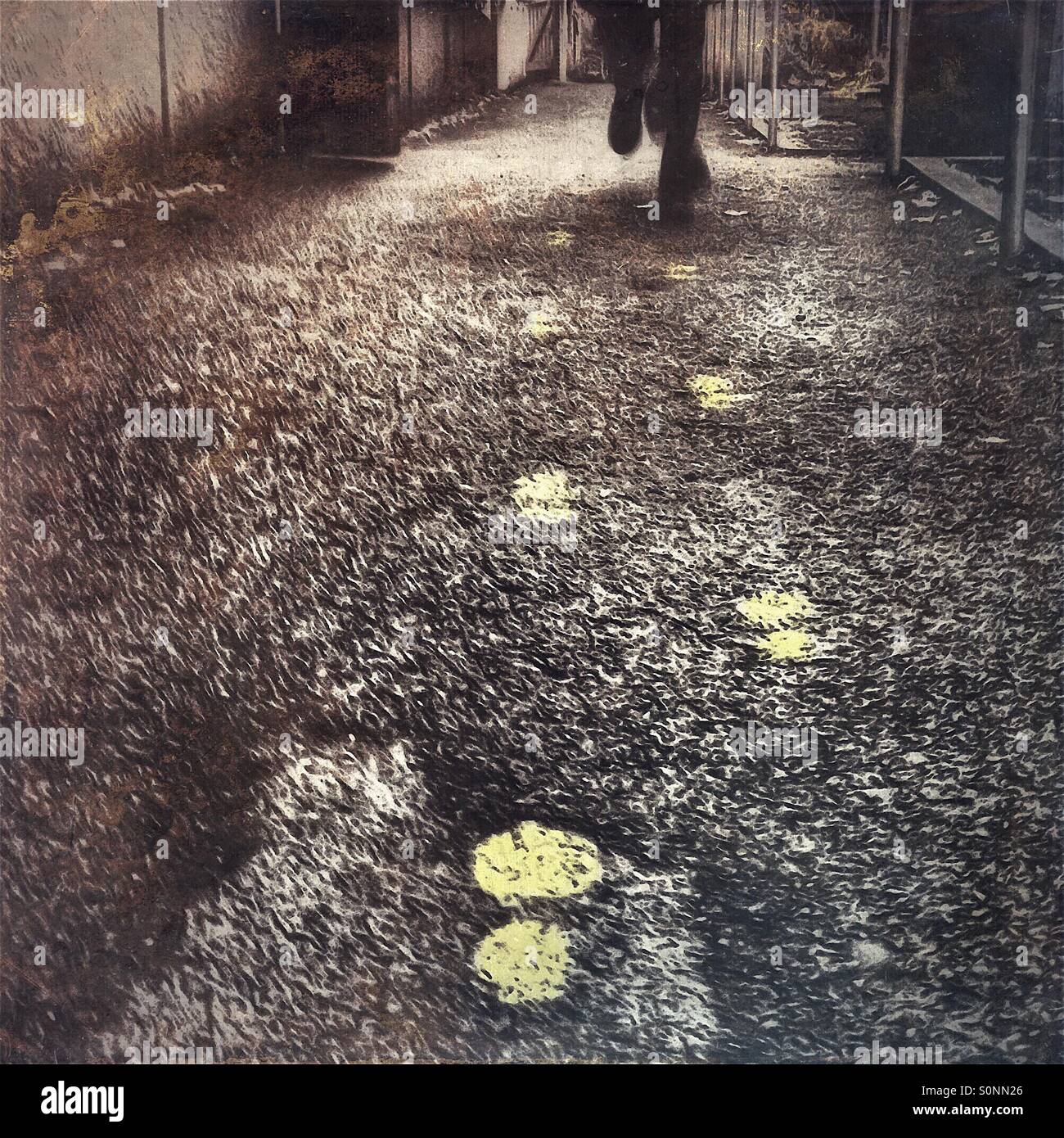 Painted footsteps and a child running Stock Photo - Alamy