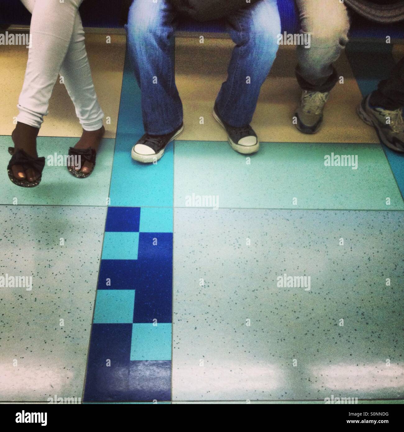 Feet on public transport hi-res stock photography and images - Alamy