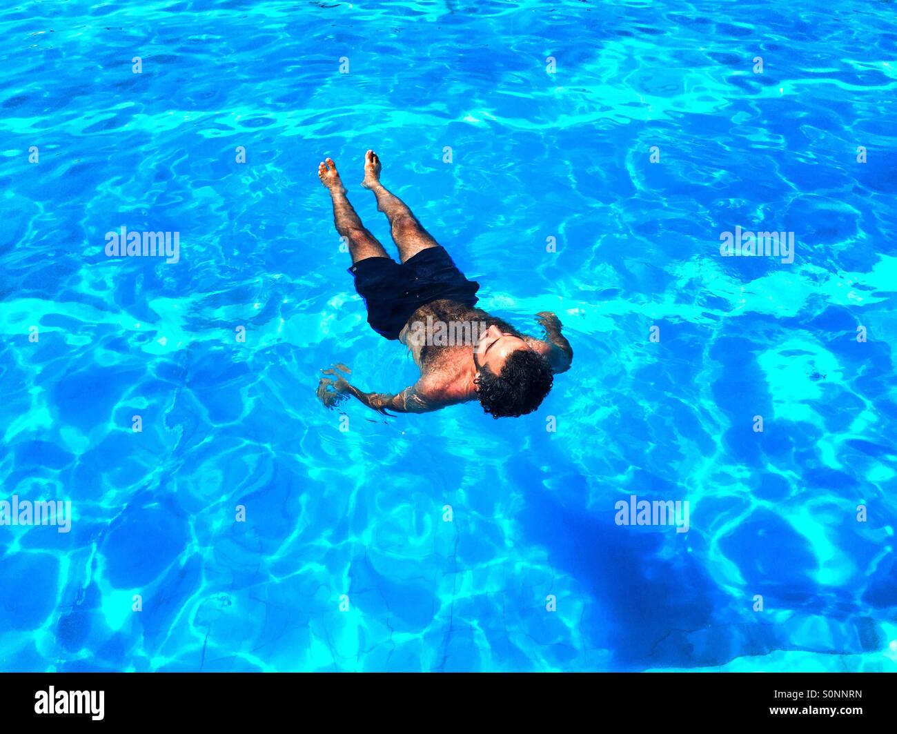 Man chilling in the swimming pool Stock Photo - Alamy Man chilling in the swimming pool Stock Photo - Alamy