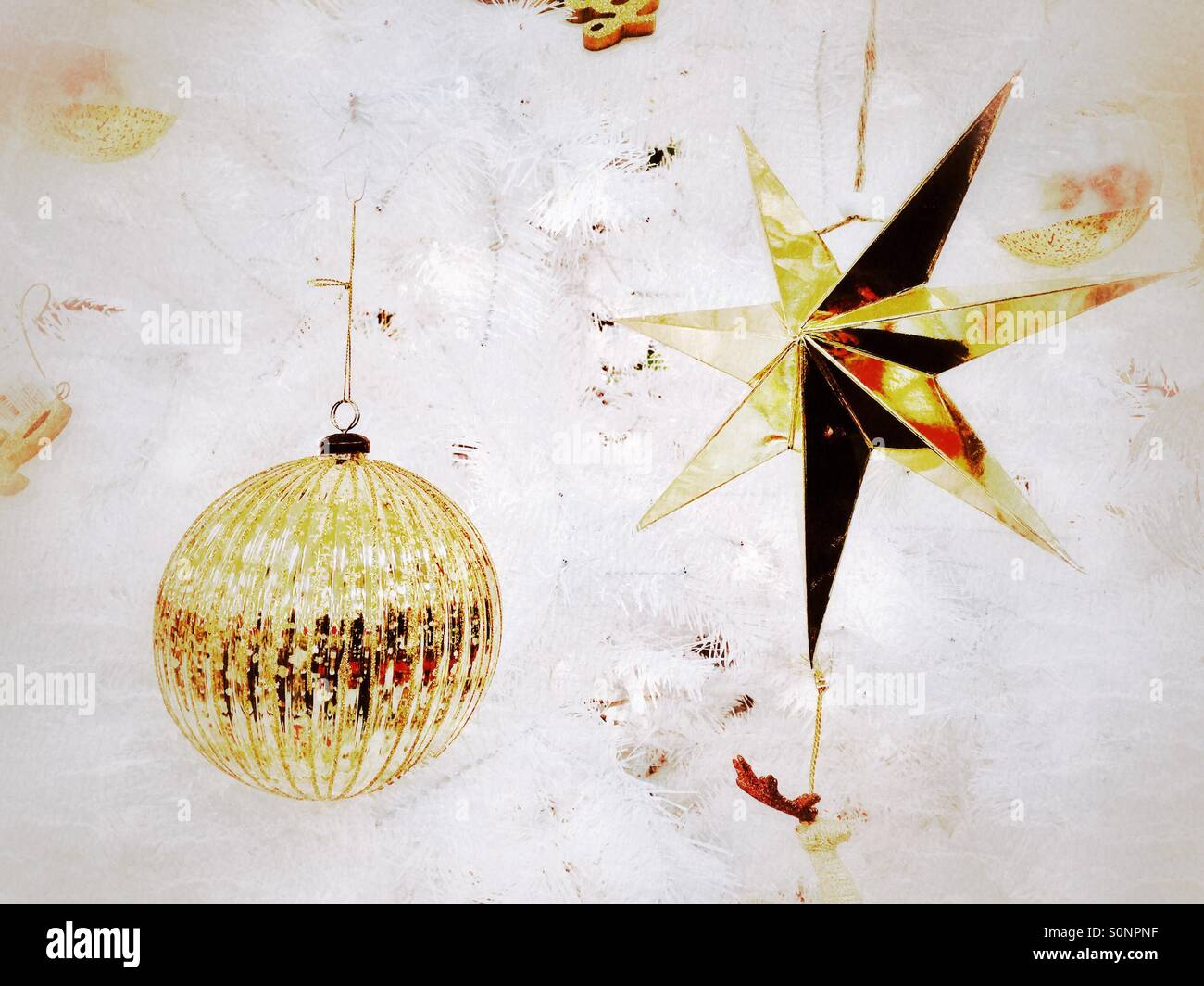 gold star and gold bubble Christmas ornaments on white tree Stock Photo ...