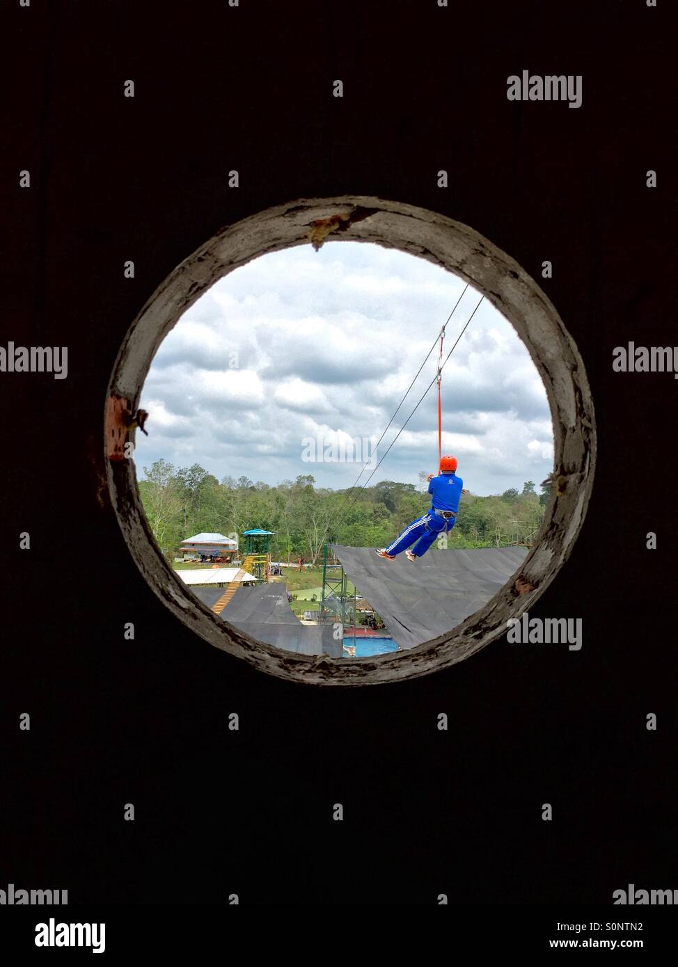 The customer play one of the outbound games, "flying fox", in Sungai ...