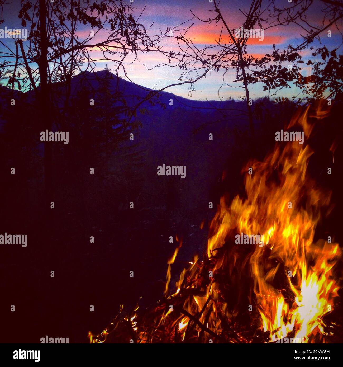 Can't stop watching the fire Stock Photo - Alamy