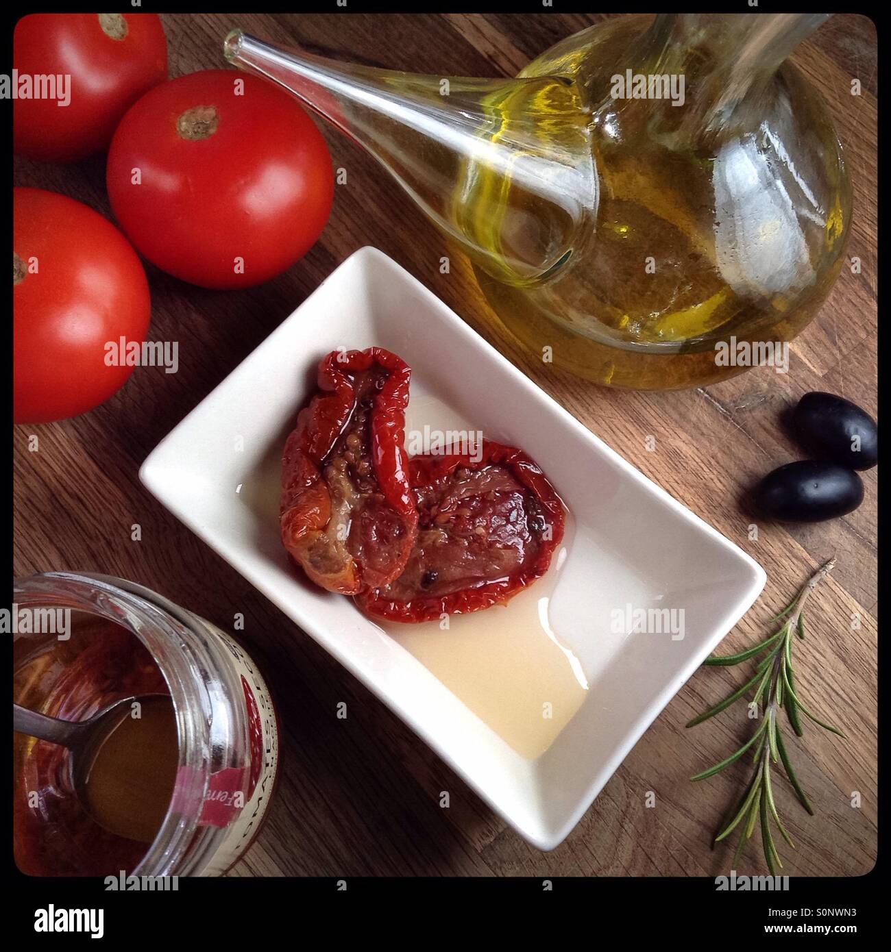 Spanish Sun dried tomatoes in olive oil Stock Photo - Alamy