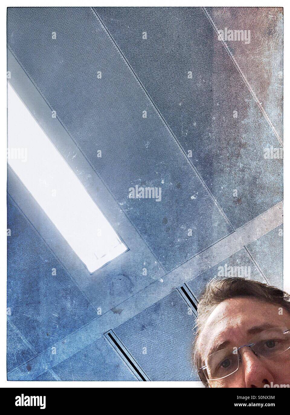 In the office. Looking down while typing Stock Photo - Alamy