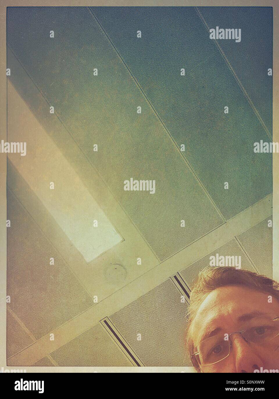 In the office. Looking down while typing Stock Photo - Alamy