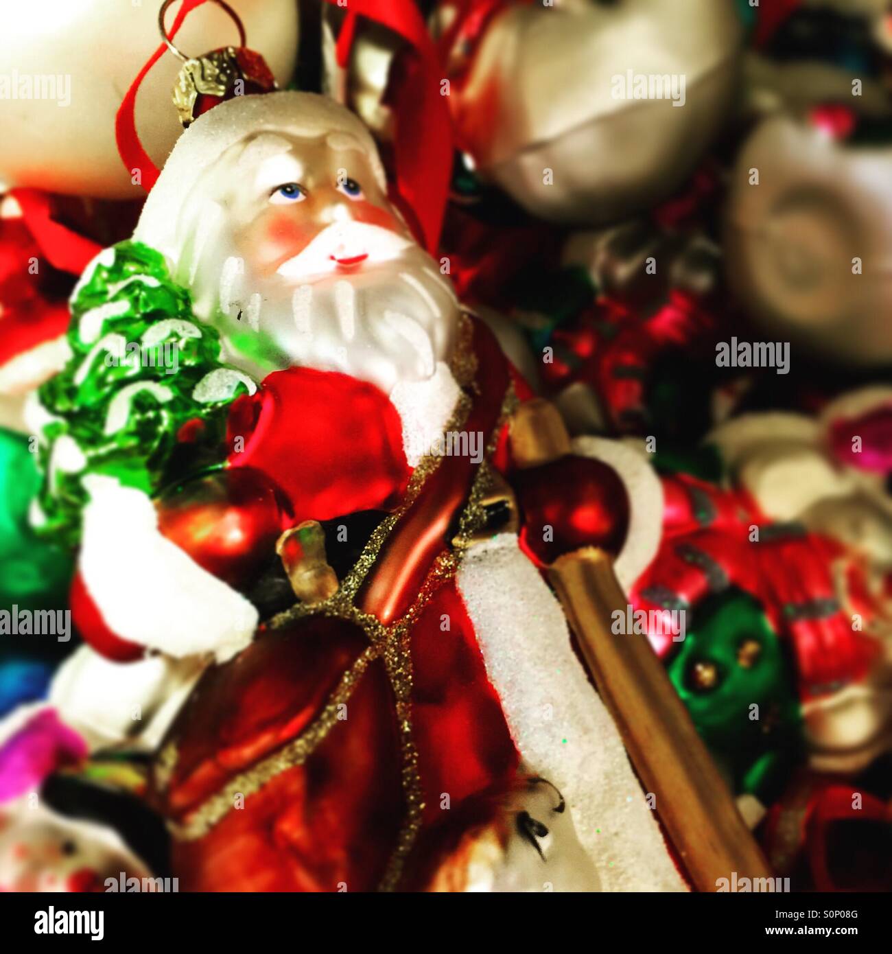Festive Father Christmas glass tree bauble Stock Photo - Alamy