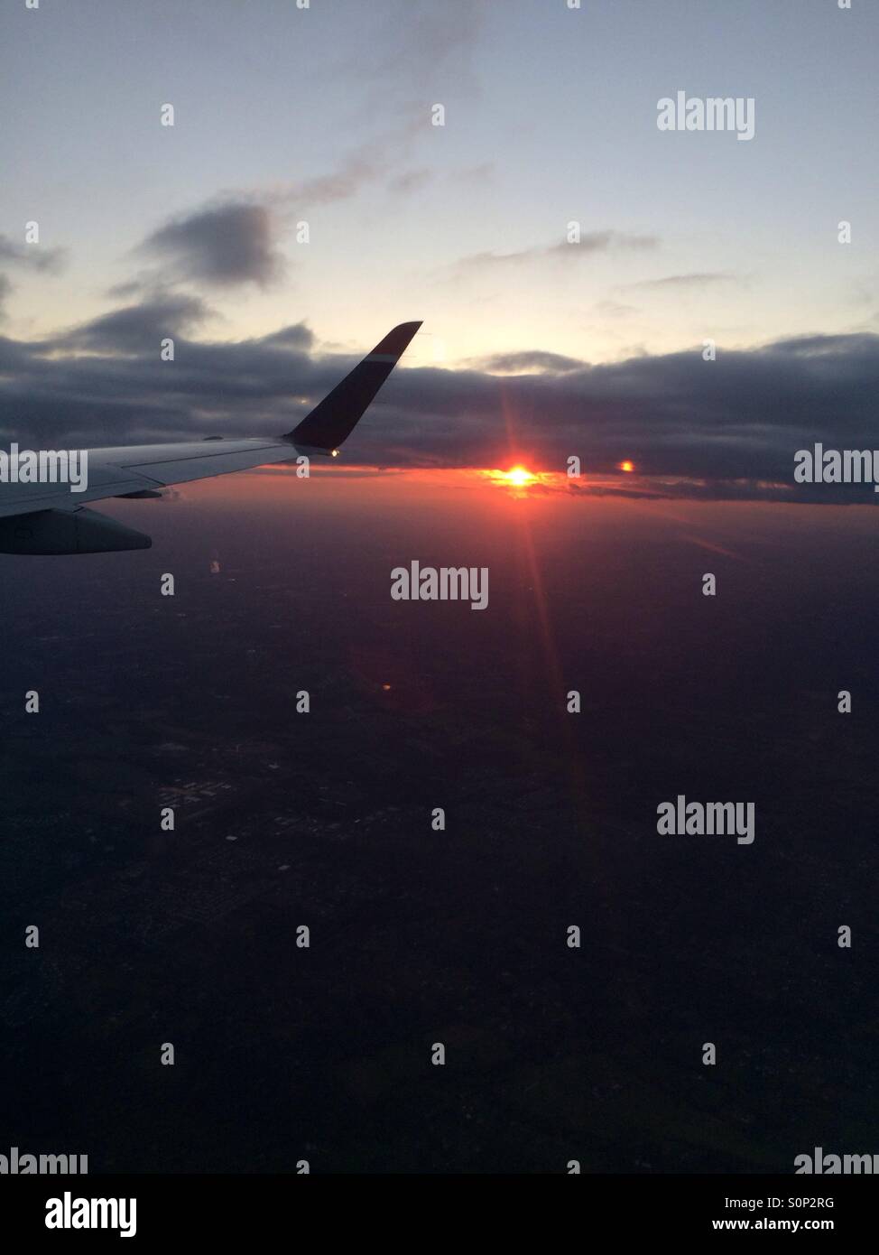 Sunset from airplane Stock Photo - Alamy