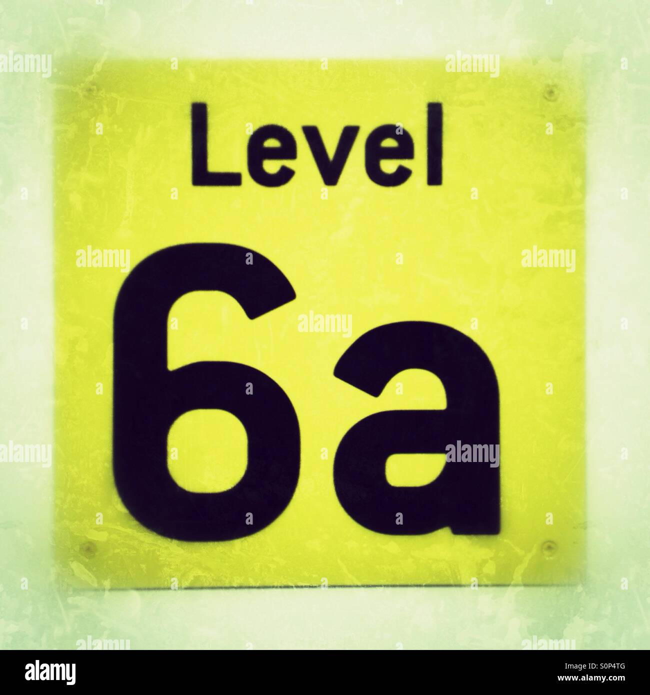 Yellow level 6a sign Stock Photo - Alamy