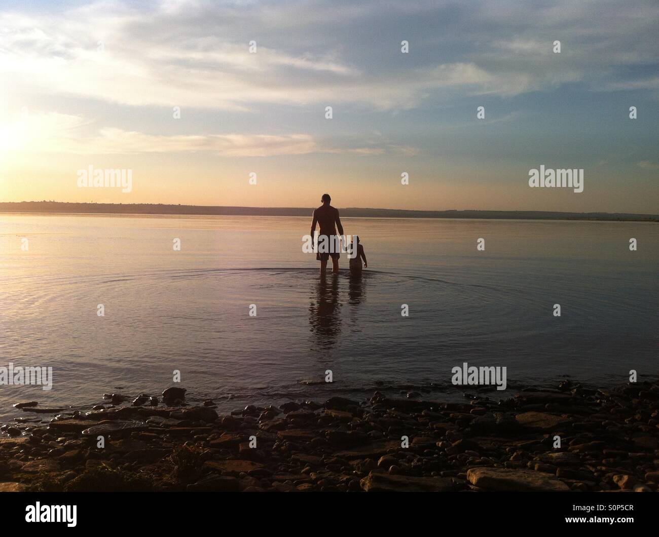 Dad with son go to swim Stock Photo - Alamy