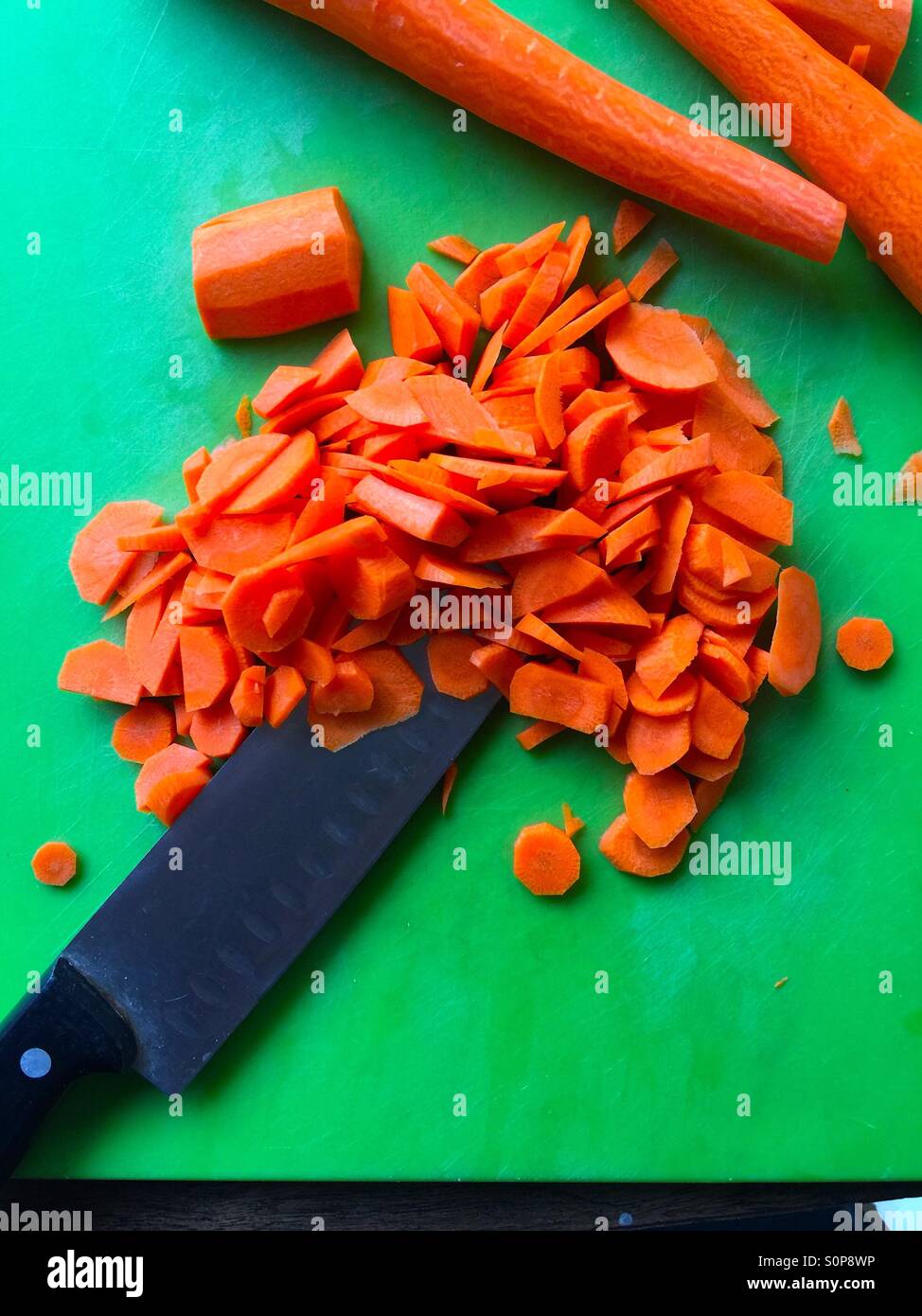 Cutting up carrots Stock Photo - Alamy