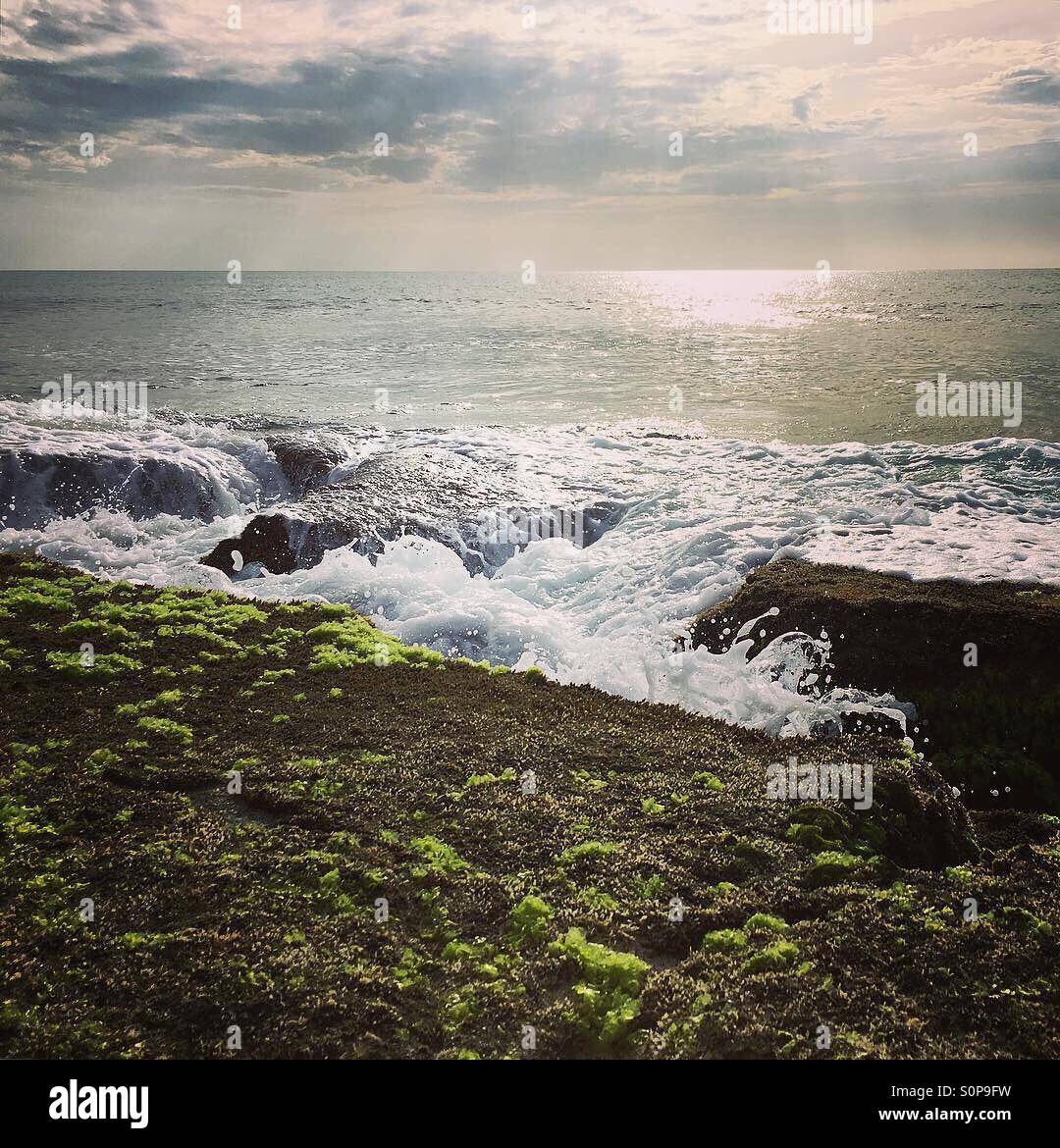 Incoming tide into the Rock pools Stock Photo - Alamy
