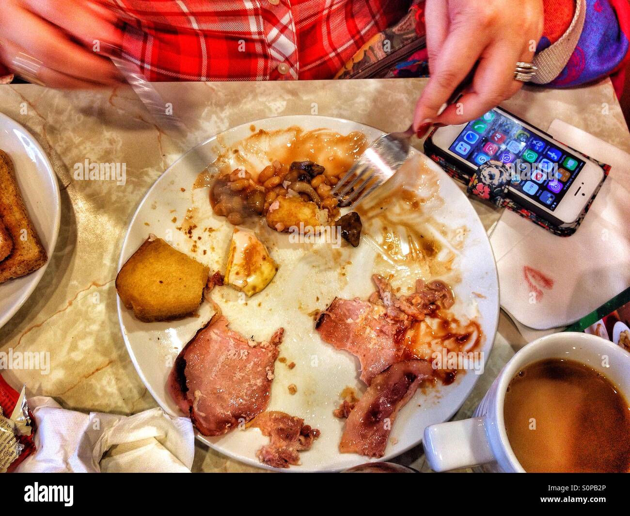 Eating an all day breakfast Stock Photo - Alamy