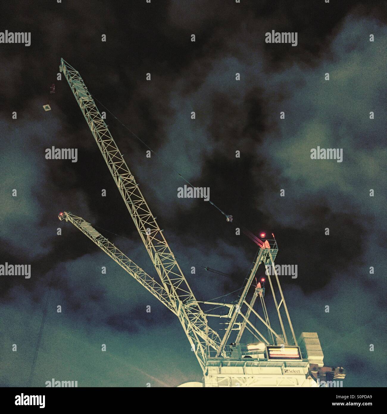Super Crane illuminated at night Stock Photo - Alamy