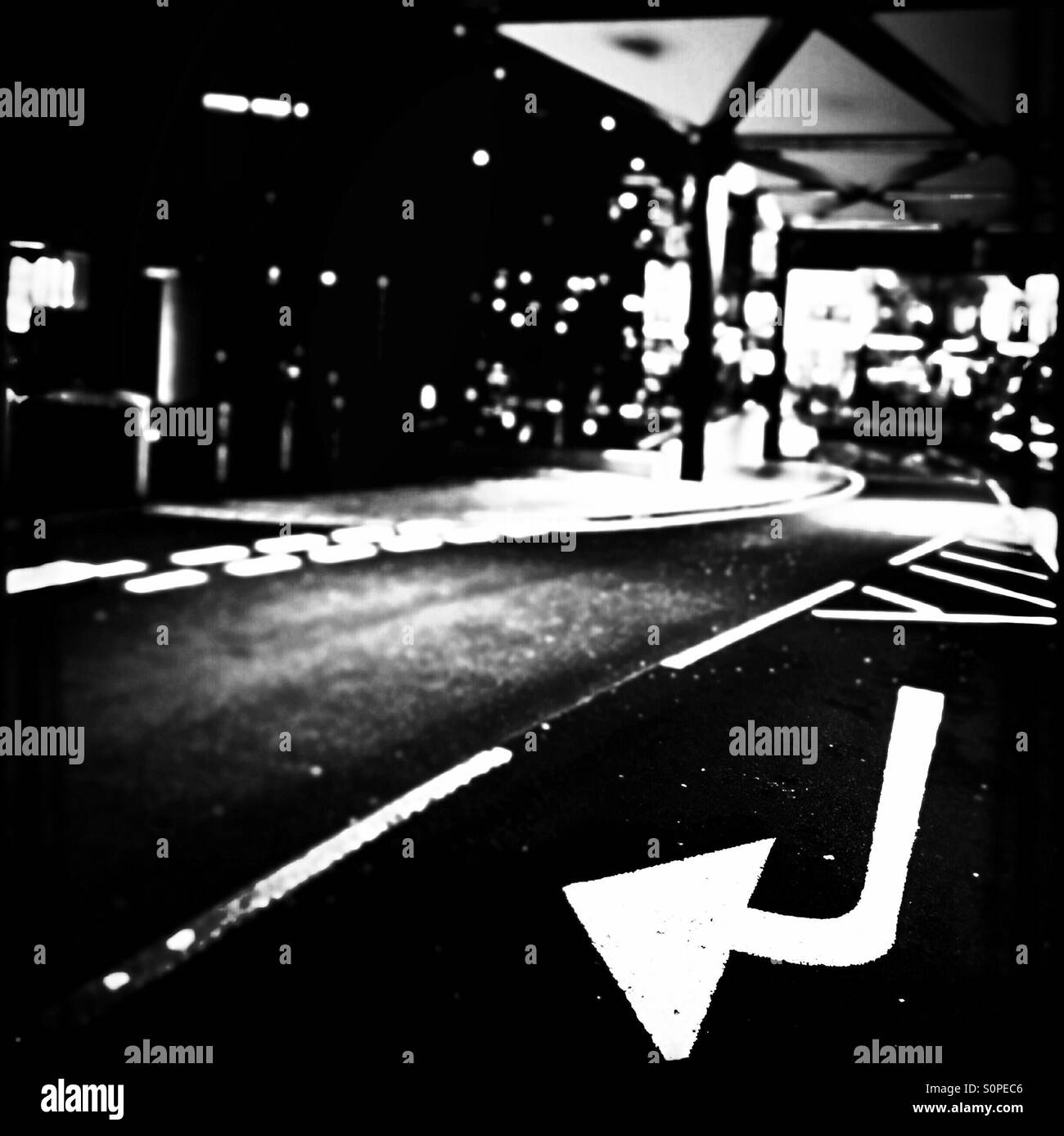 Arrow arrows road markings direction Black and White Stock Photos ...