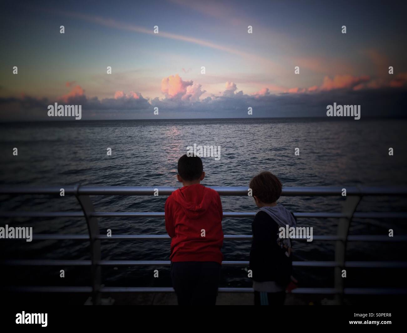 Two kids watching the sea Stock Photo - Alamy