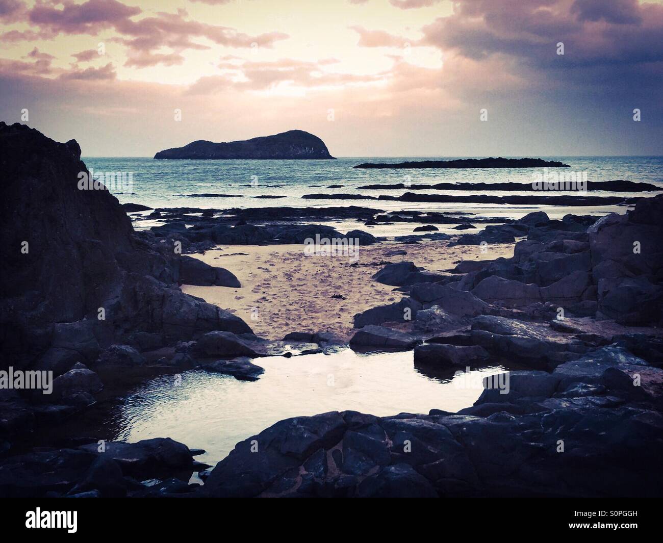 Rocks and rock pools at low tide Stock Photo - Alamy