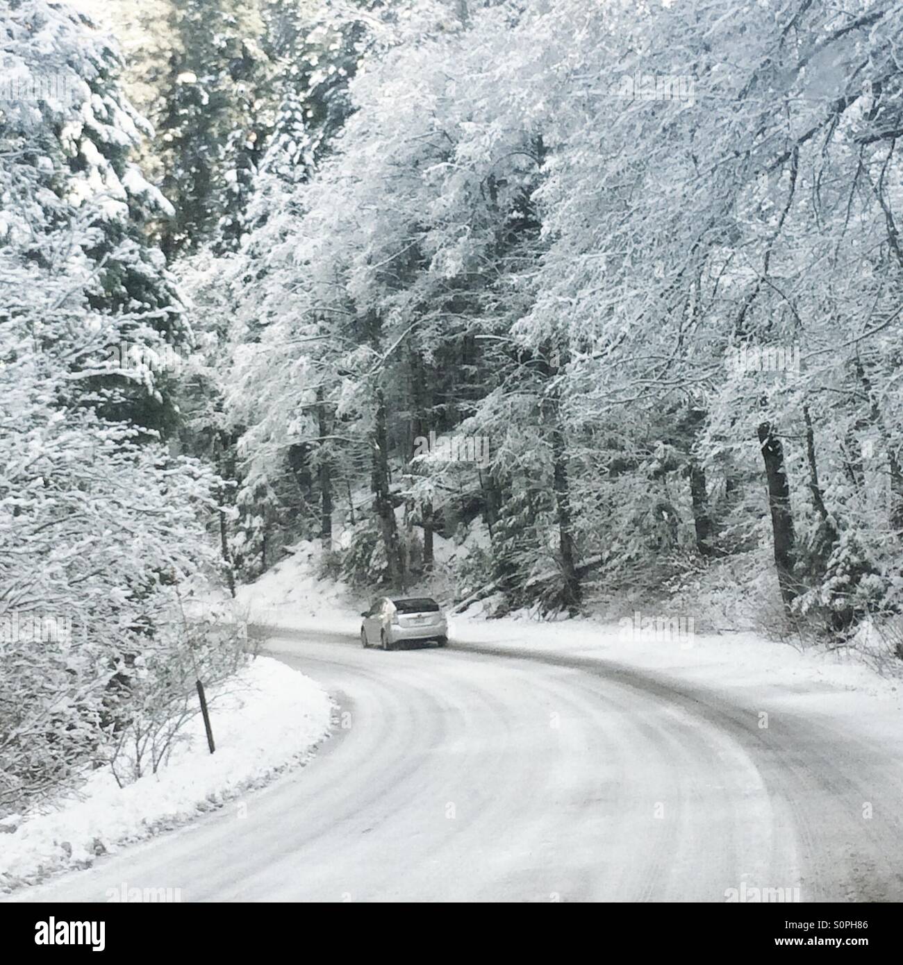 Car driving on snowy road Stock Photo - Alamy