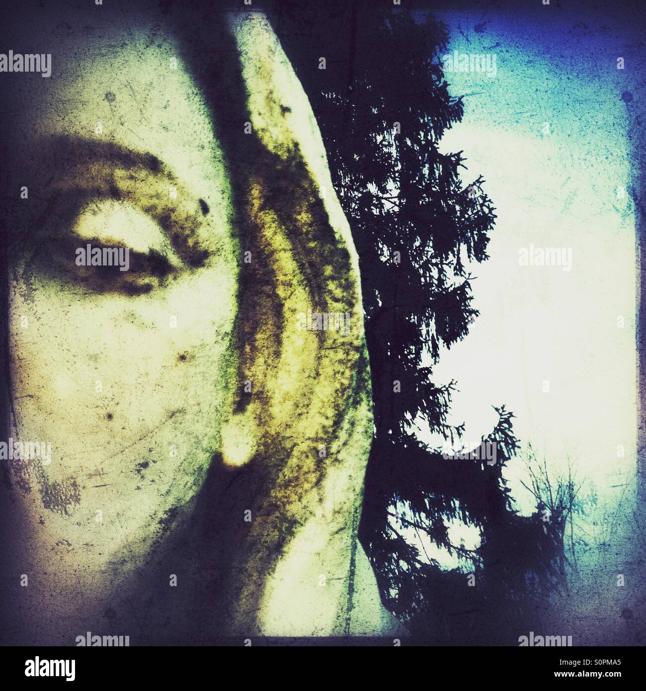 One eye of a Jesus statue Stock Photo - Alamy