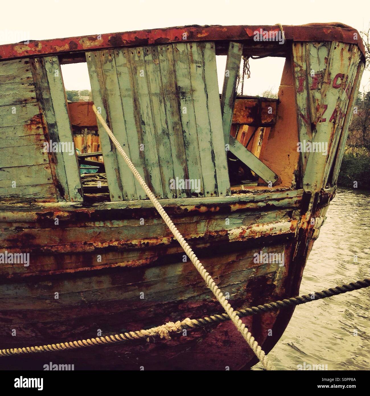 A rundown boat in Exeter canal Stock Photo - Alamy