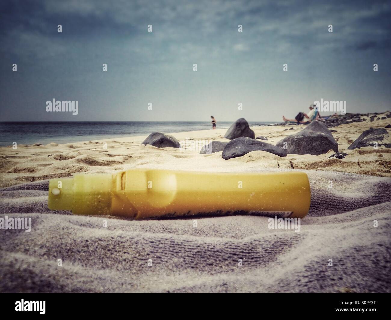 Sun lotion bottle towel hi-res stock photography and images - Alamy