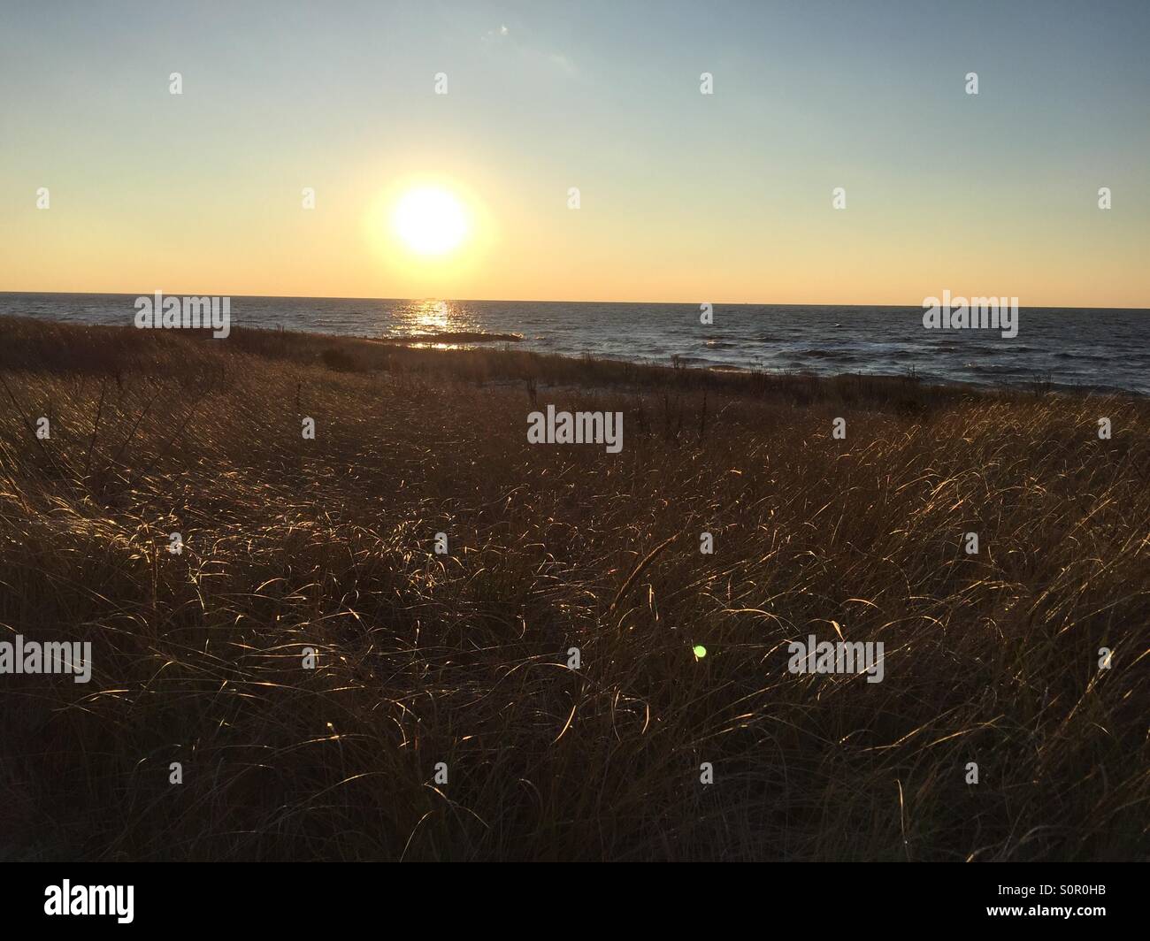 Sunset bay beach hi-res stock photography and images - Alamy