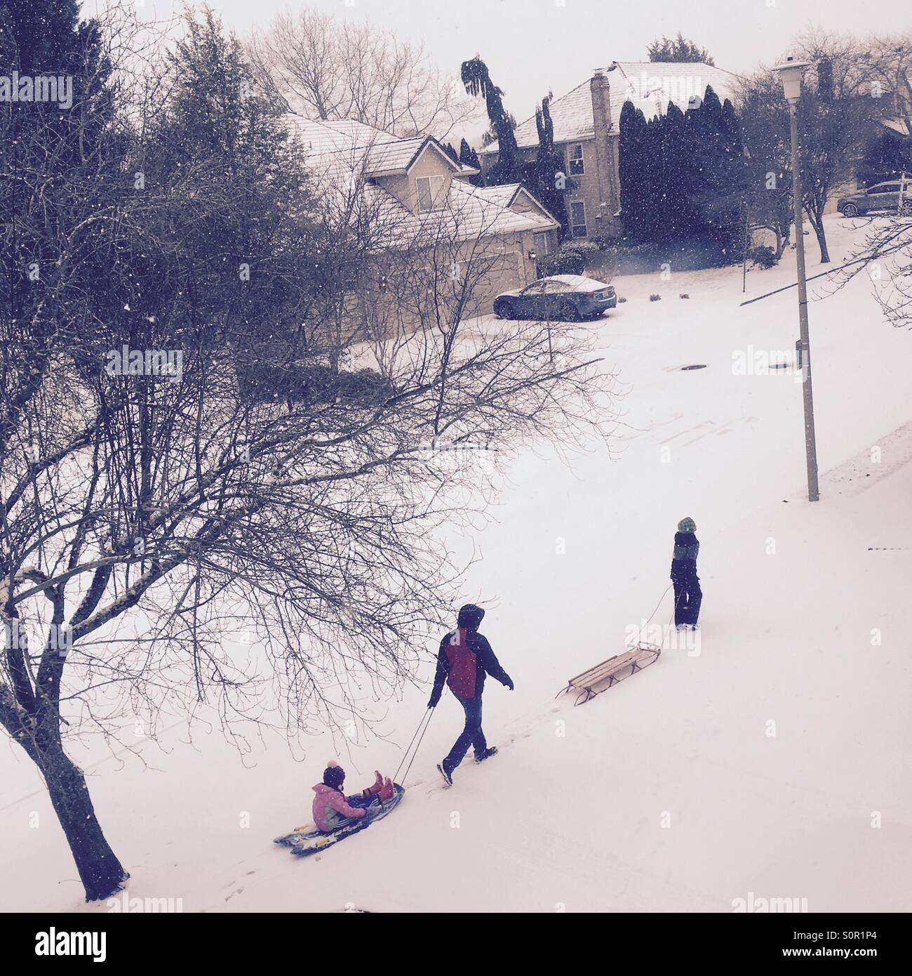 Snow fun kids sledding hi-res stock photography and images - Alamy